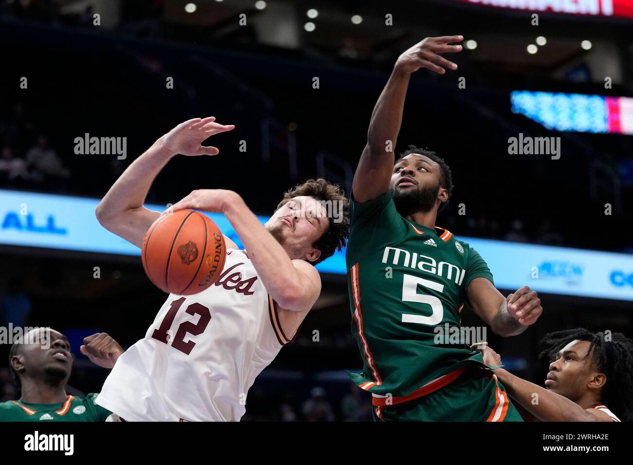 Boston College forward Quinten Post (12) beats out Miami guard Wooga ...