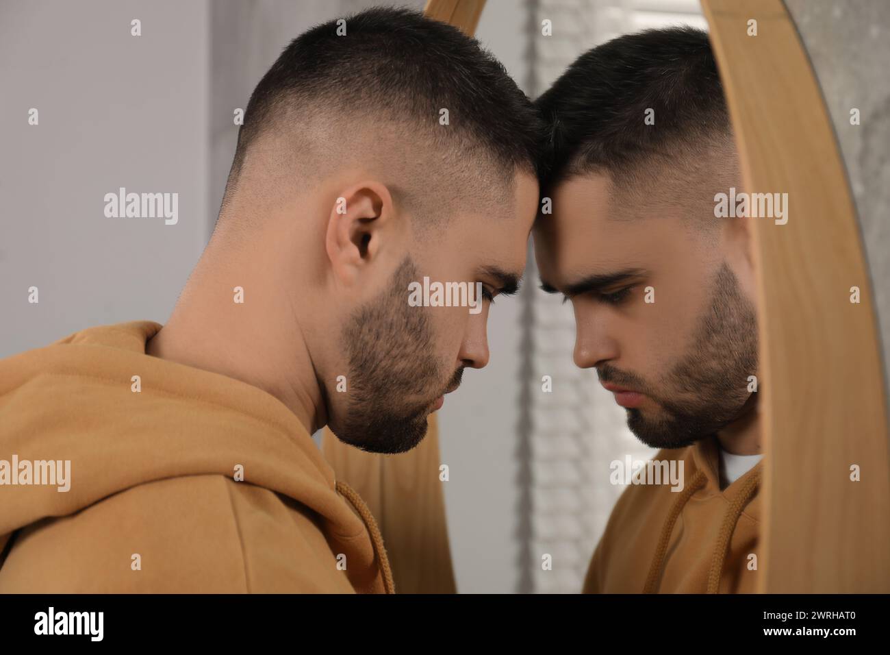 Mirror reflection face sad male hi-res stock photography and images - Alamy