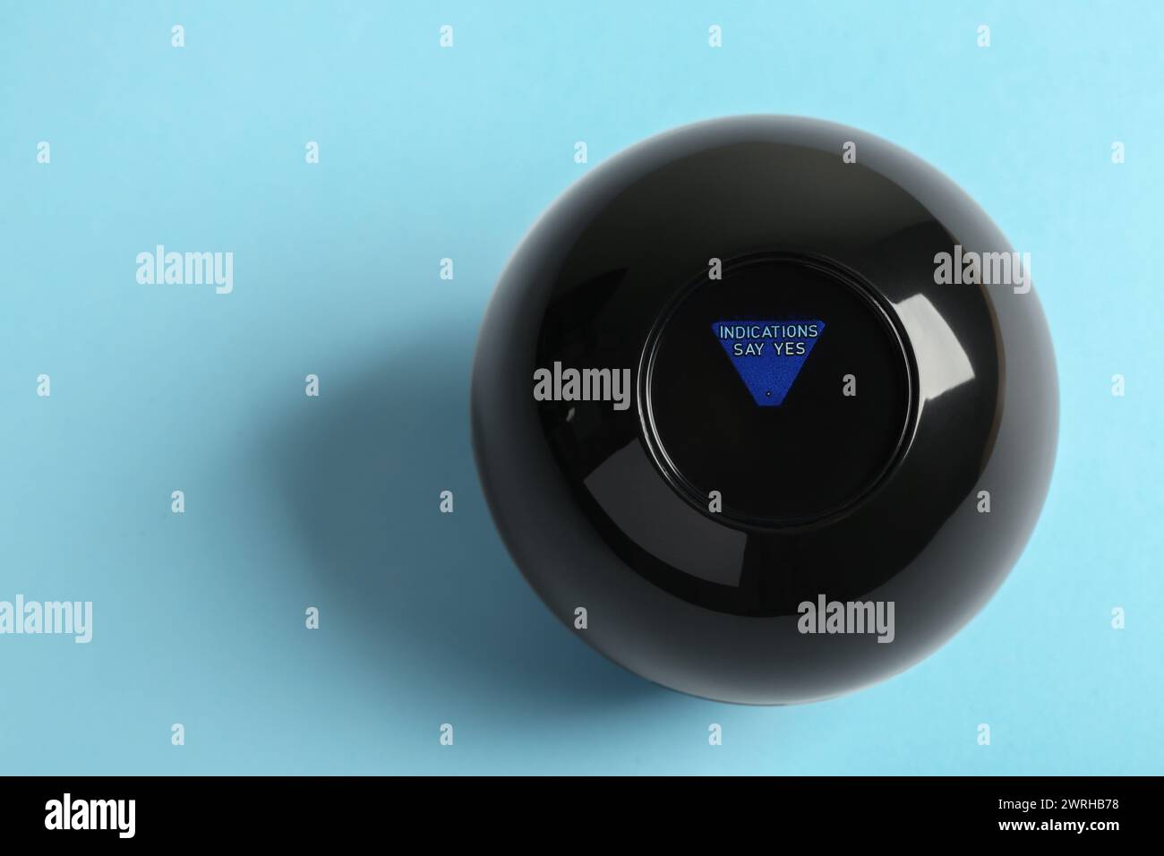 Magic eight ball with prediction Indications Say Yes on light blue ...