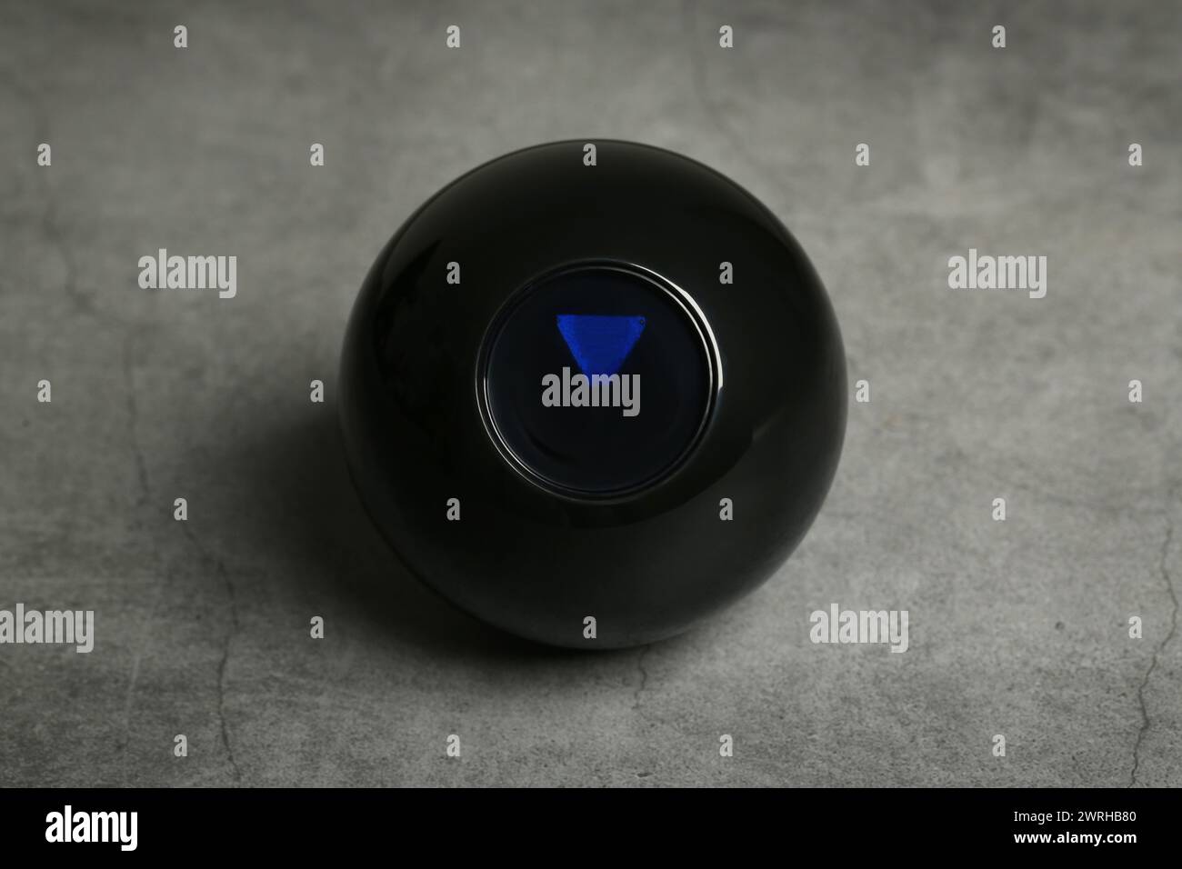 One magic eight ball on grey table Stock Photo - Alamy