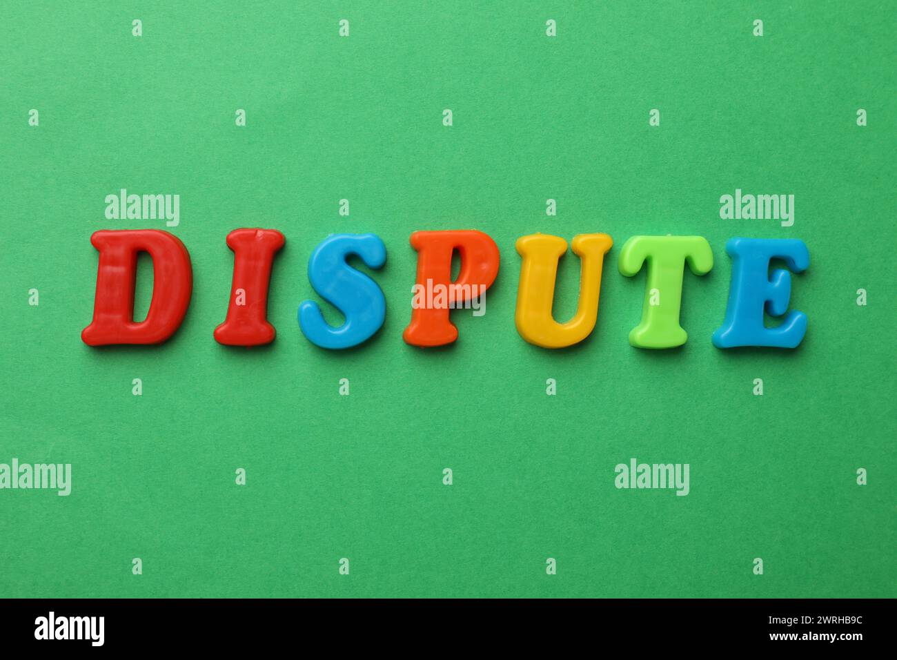 Word Dispute made of colorful letters on green background, flat lay ...