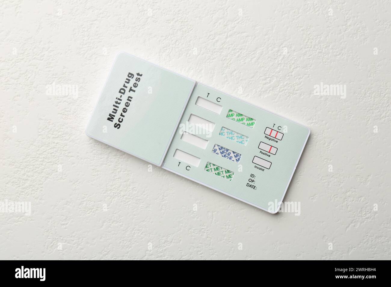 Multi-drug screen test on white textured table, top view Stock Photo ...