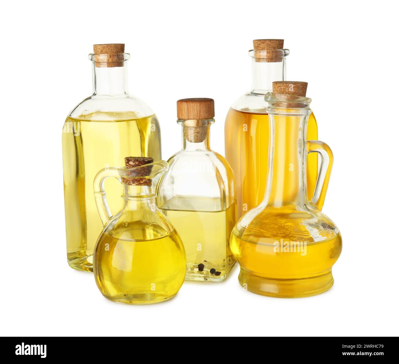Vegetable fats. Glassware of different cooking oils isolated on white ...
