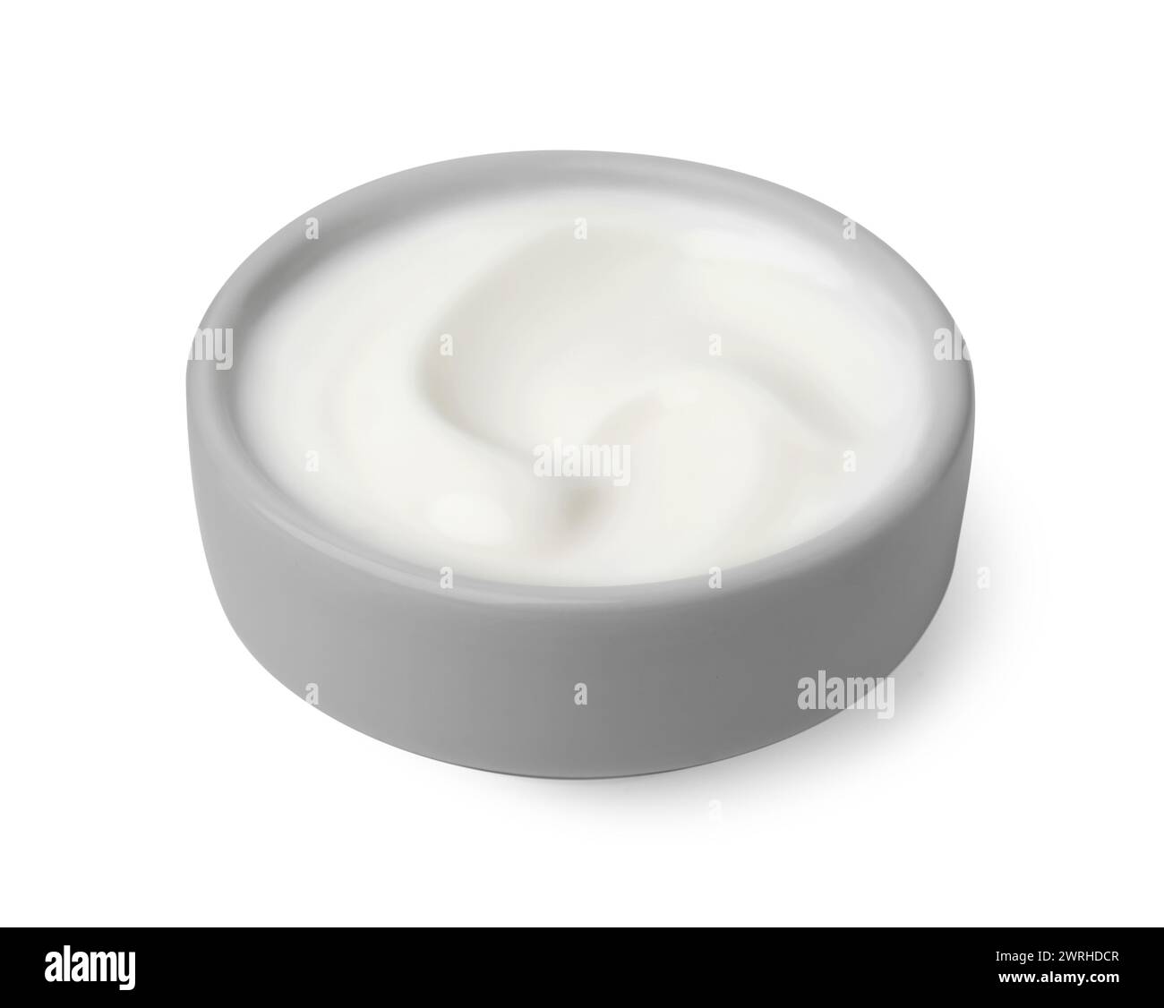 Delicious natural yogurt in bowl isolated on white Stock Photo - Alamy