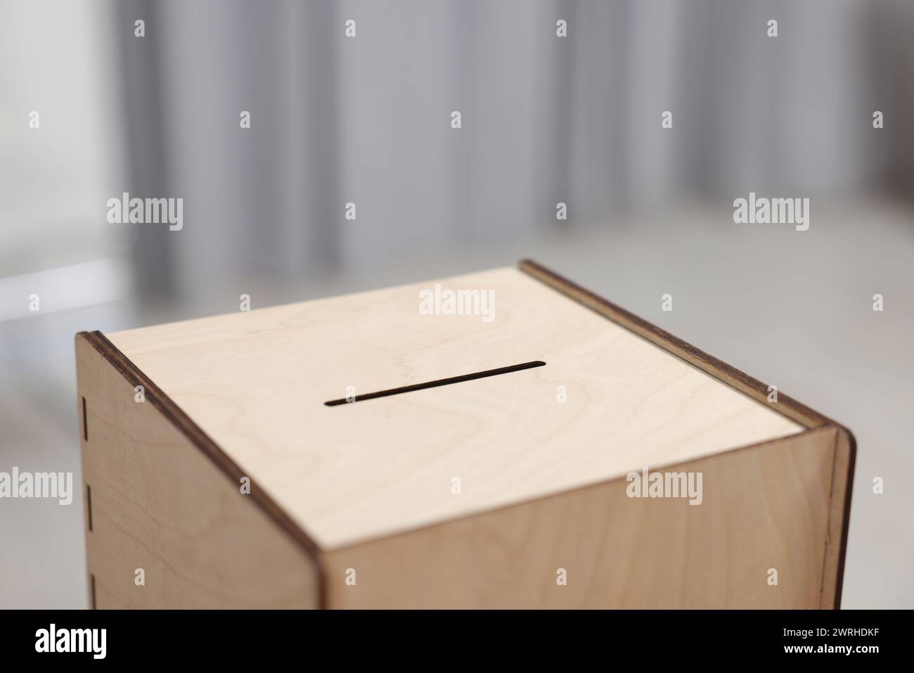 Wooden ballot box on blurred background, closeup Stock Photo - Alamy