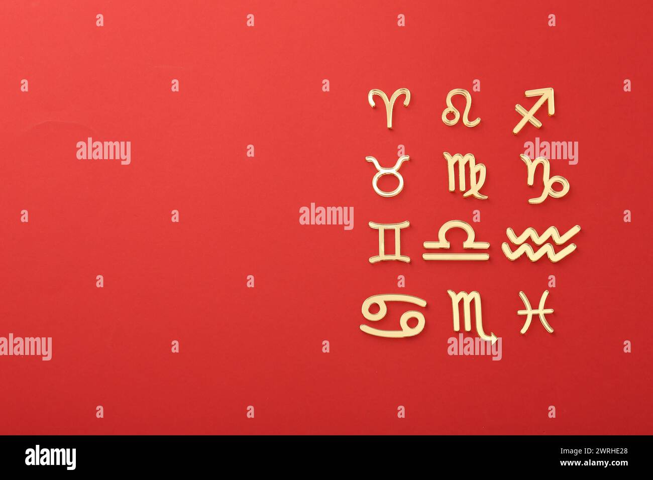 Zodiac signs on red background, flat lay. Space for text Stock Photo ...