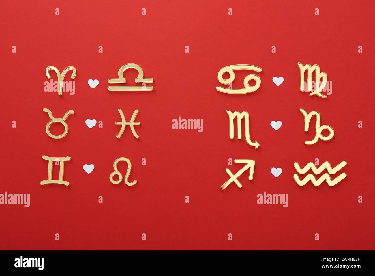 Zodiac signs compatibility on red background, flat lay Stock Photo - Alamy