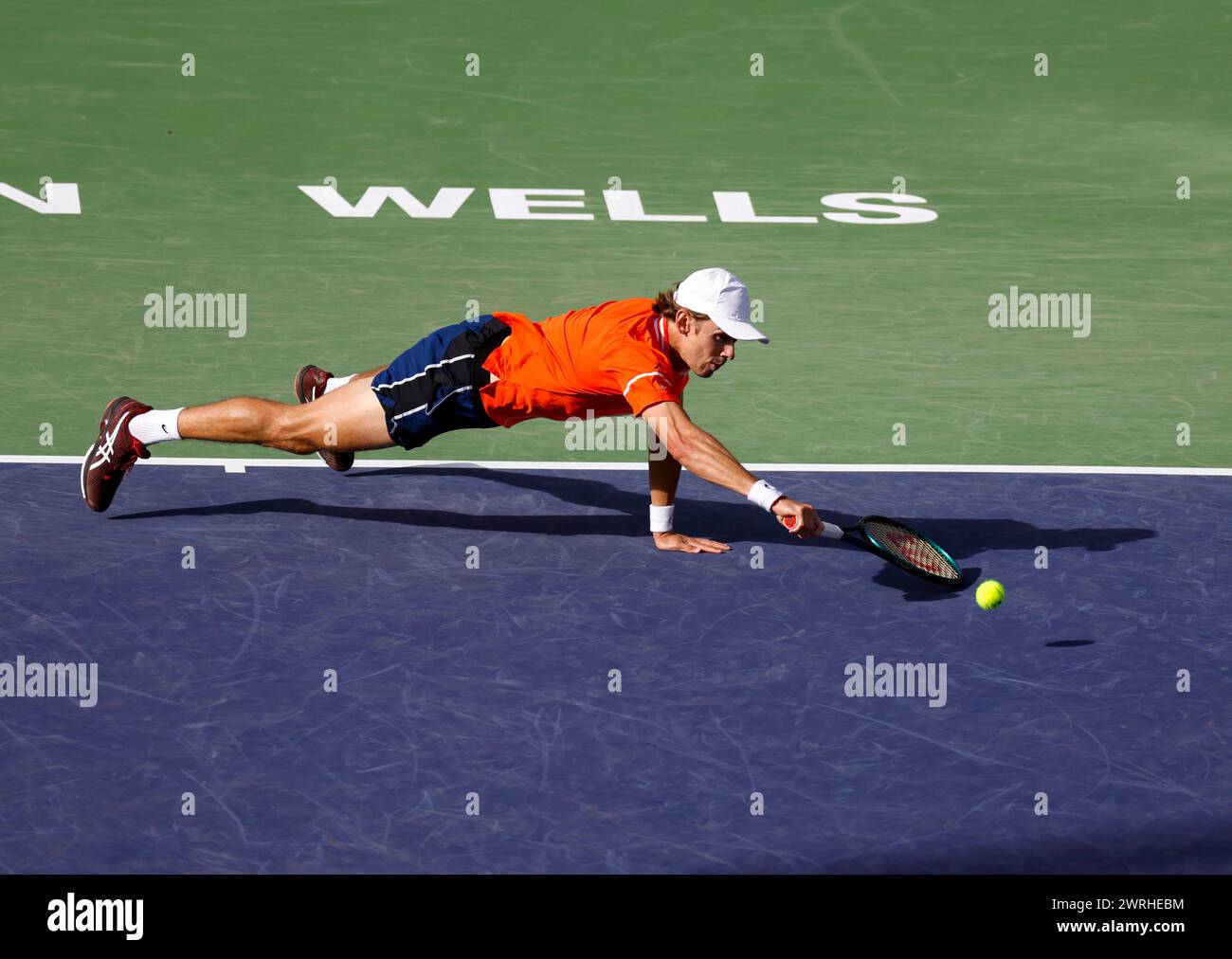 March 12, 2024 Alex De Minaur of Australia dives for the ball against ...