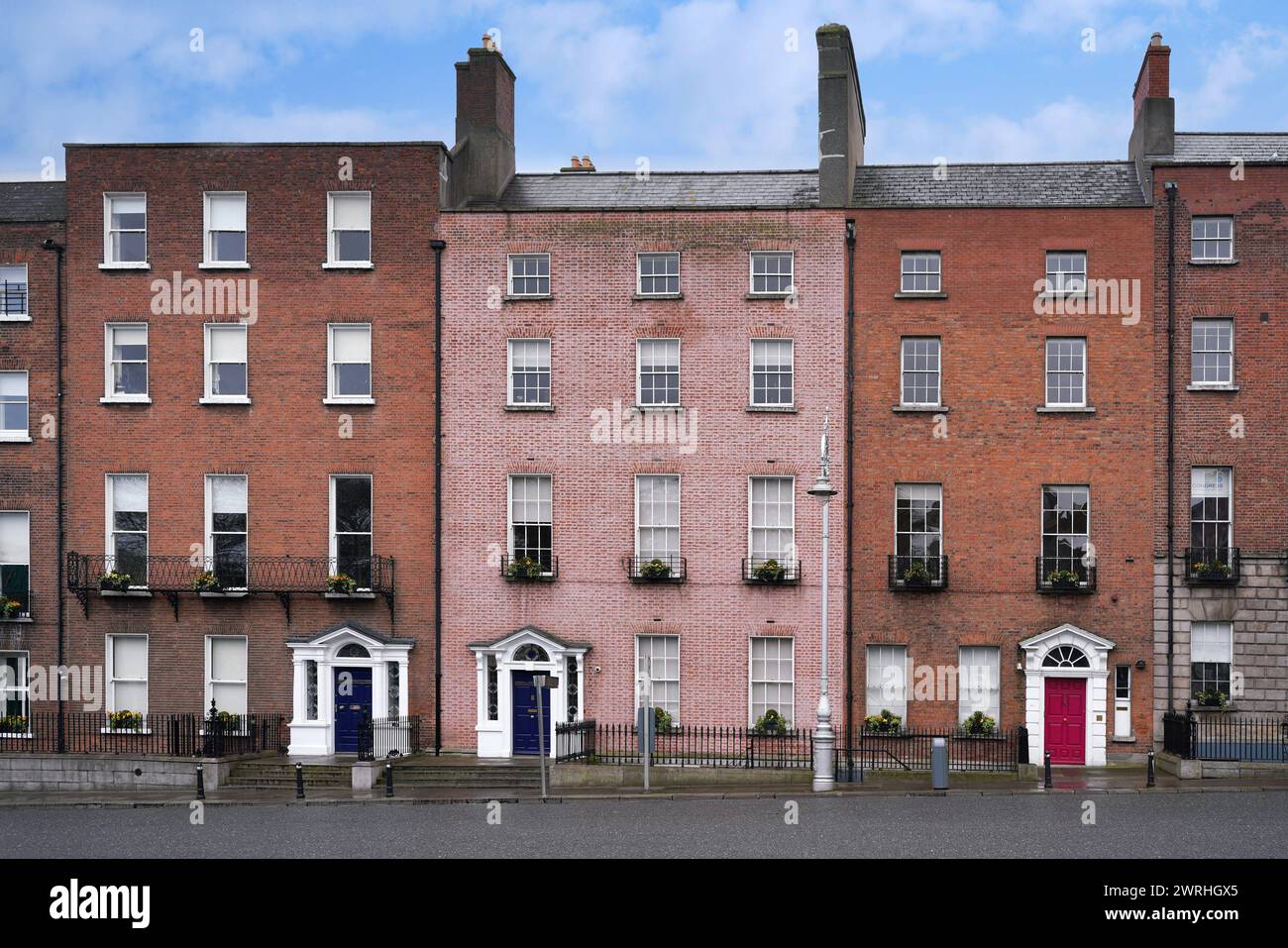 Row of 18th century brick townhouses typical of central Dublin Stock ...