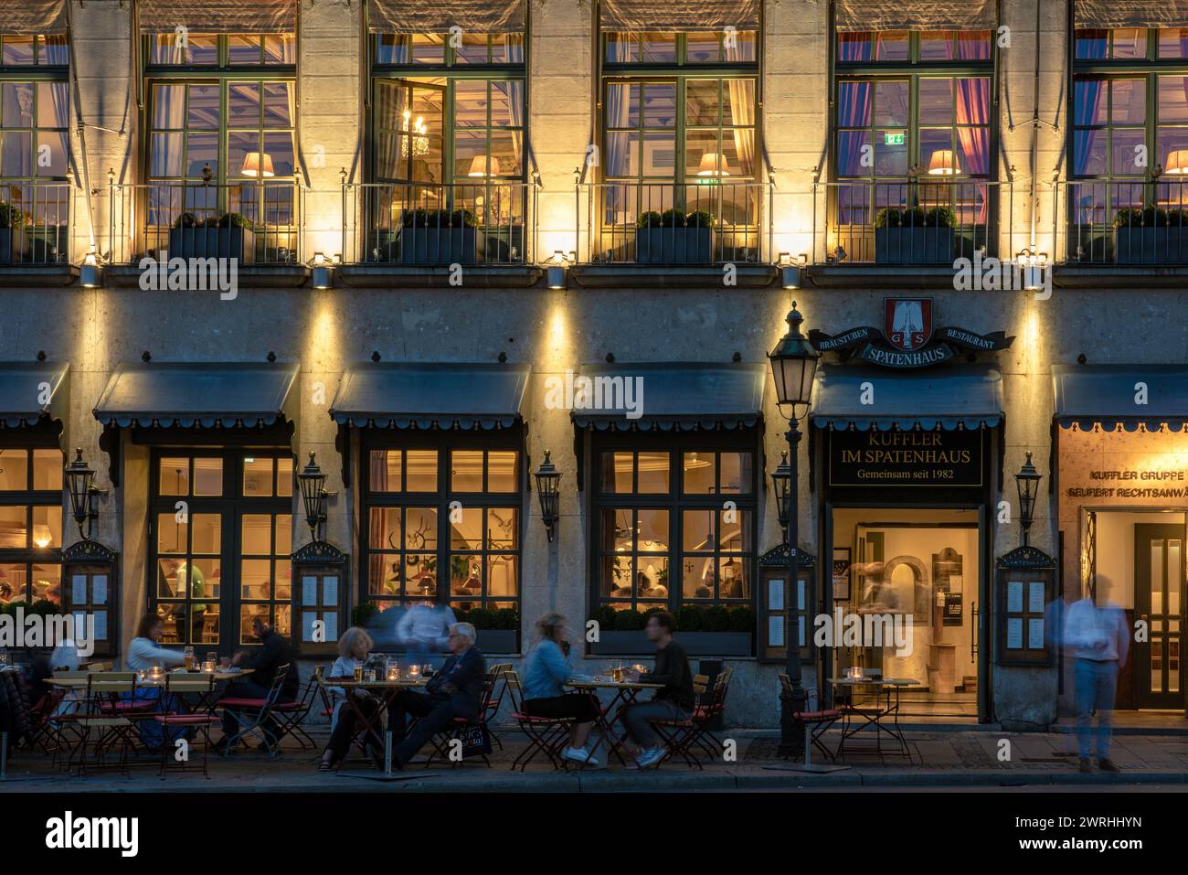 Traditional German architecture with a restaurant in the Munich city ...
