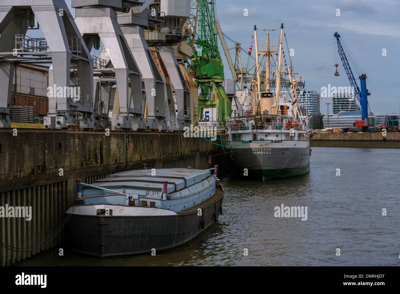 View of old ships docked along the riverside at the Deutsches ...
