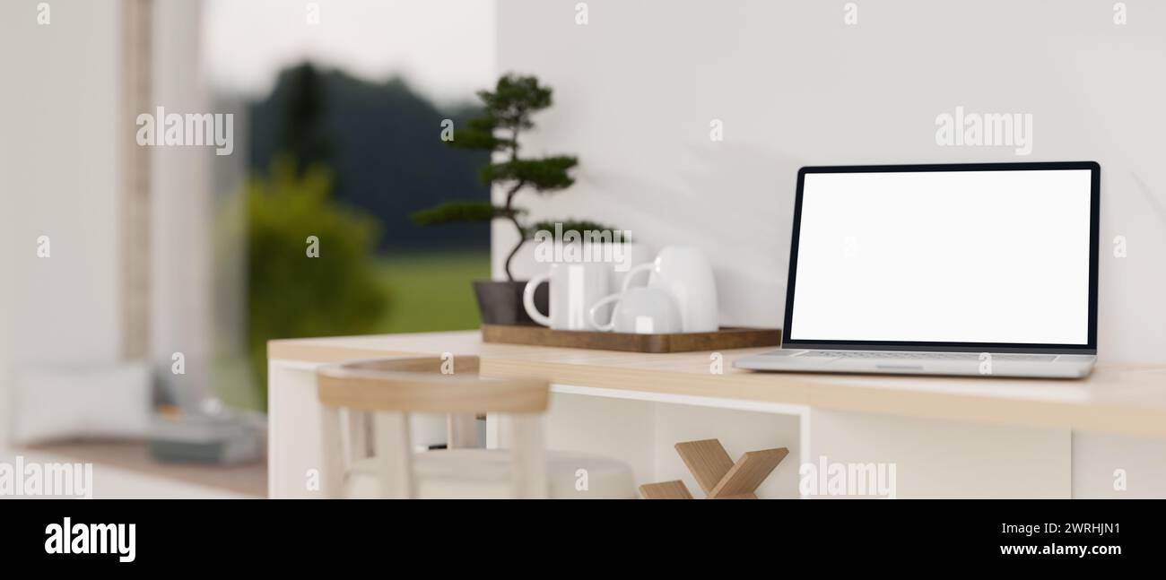 A white-screen laptop computer mockup on a wooden cabinet countertop in ...