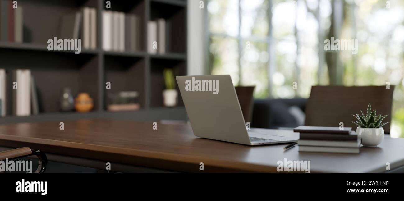 A laptop computer on a meeting table in a contemporary meeting room ...