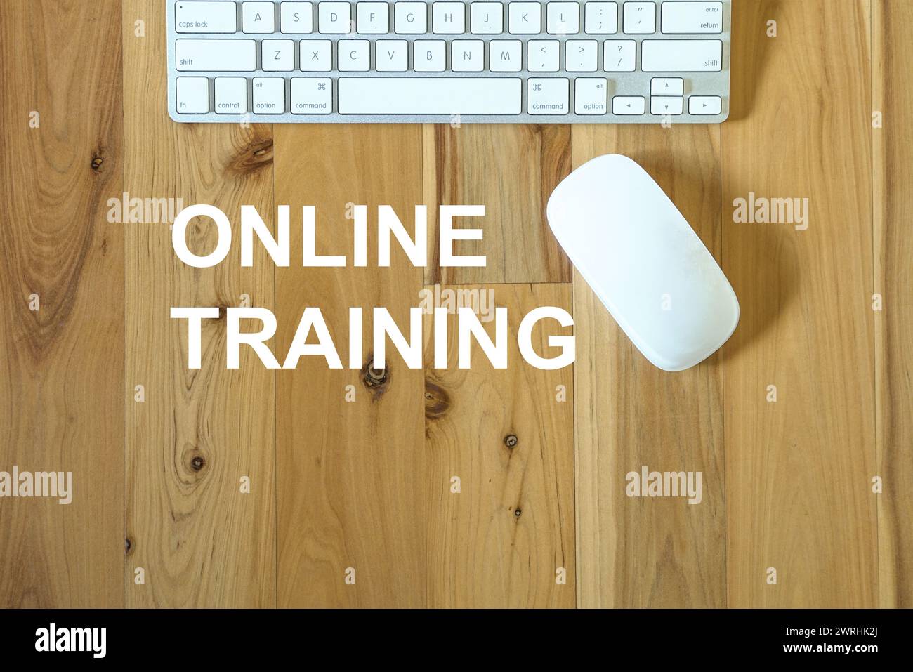 Online training words on top of office desk with keyboard and mouse ...