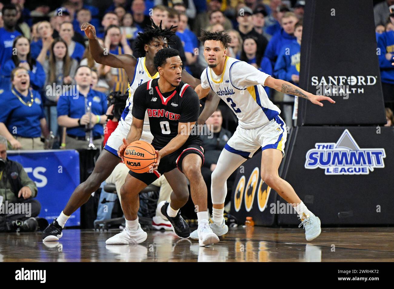 Denver Pioneers guard Tommy Bruner (0) makes a move to the basket while ...