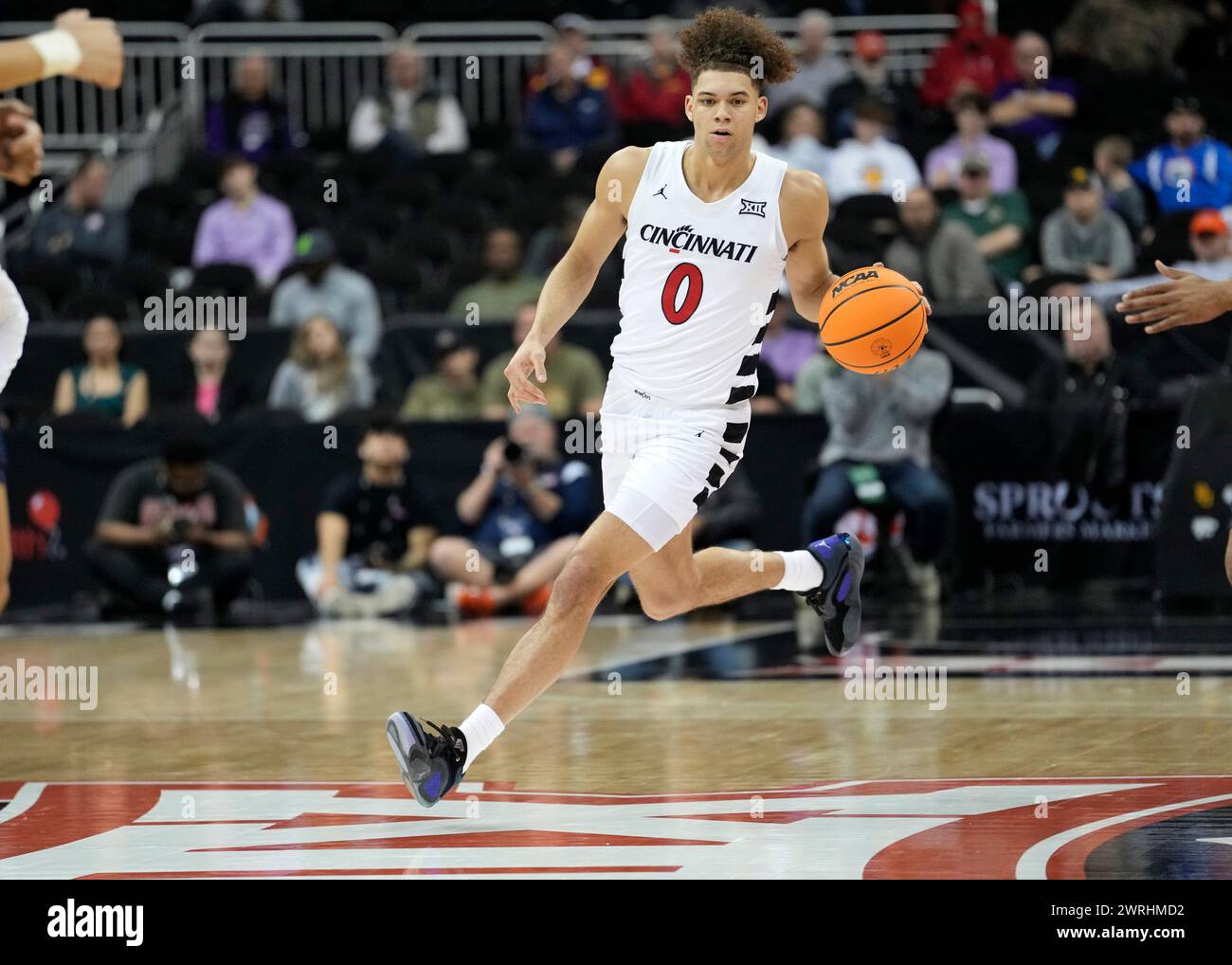 MAR 12 2024: Cincinnati Bearcats guard Dan Skillings Jr. (0) brings the ...