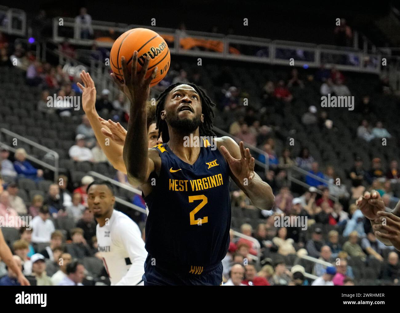 MAR 12 2024: West Virginia Mountaineers guard Kobe Johnson (2) drives ...