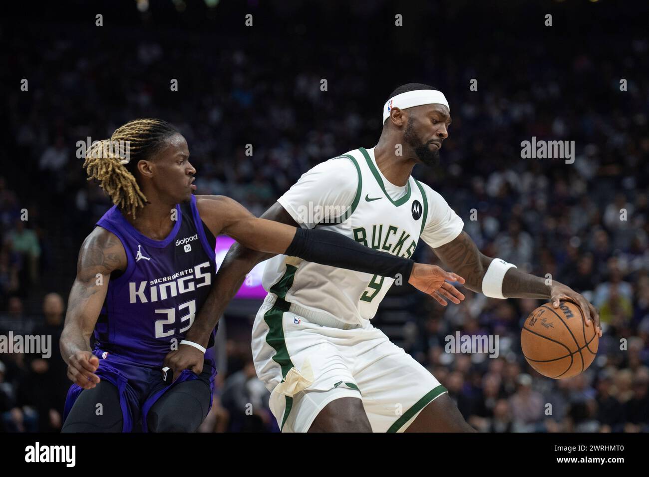 Sacramento Kings guard Keon Ellis (23) defends Milwaukee Bucks forward ...