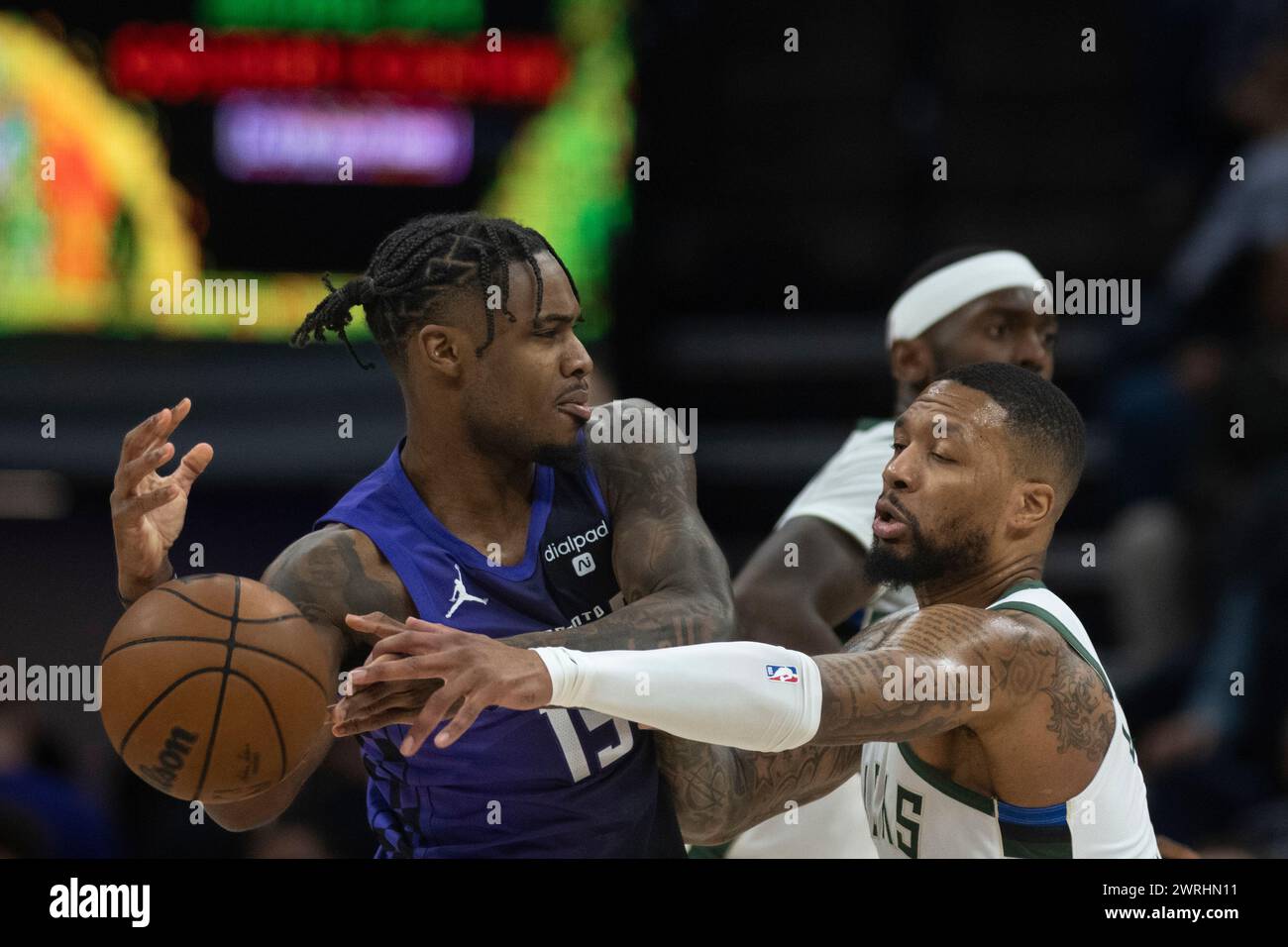 Milwaukee Bucks guard Damian Lillard (0) slaps the ball away from ...