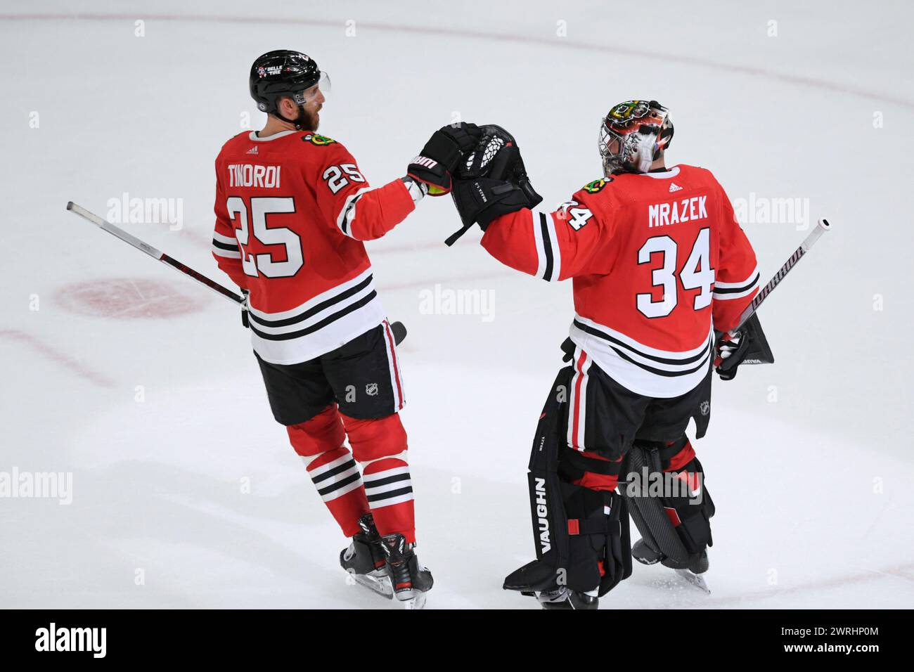 Chicago Blackhawks goalie Petr Mrazek (34) celebrates with Jarred ...