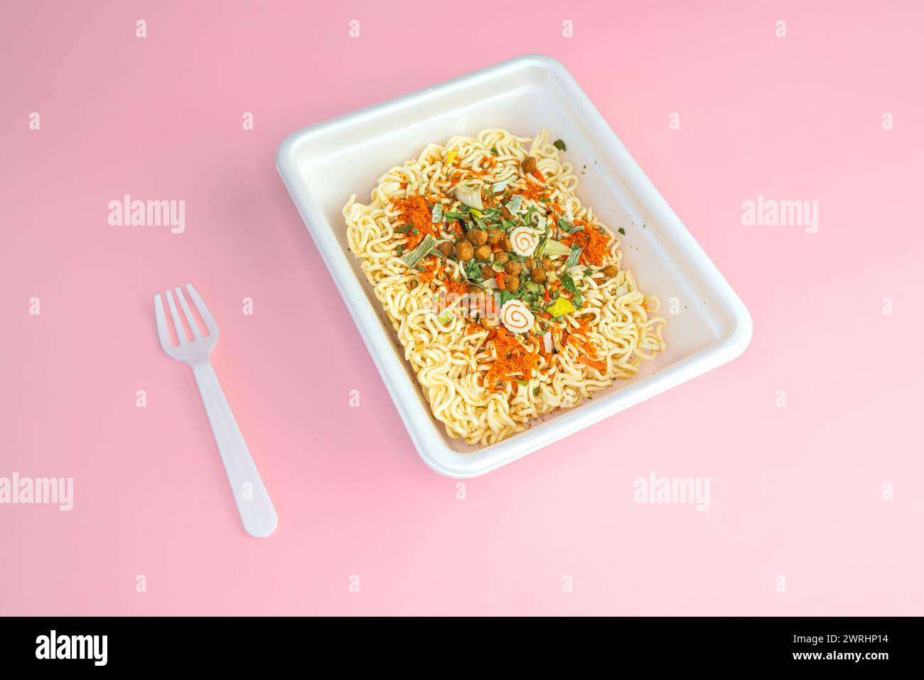 White box of noodles on an pink background, fast cheap food. Chinese ...