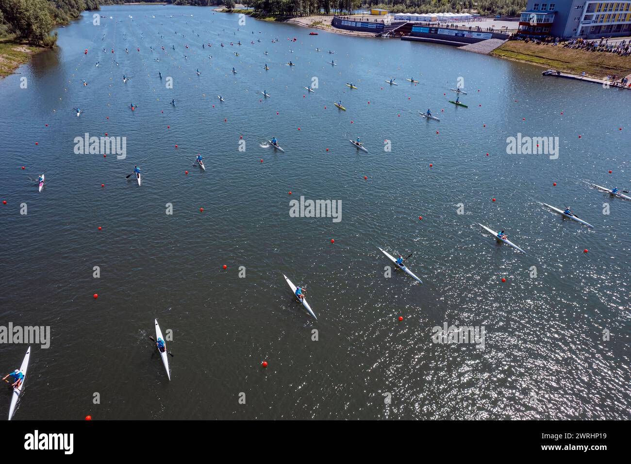 training of rowers on kayaks and canoes on the rowing channel. top view ...