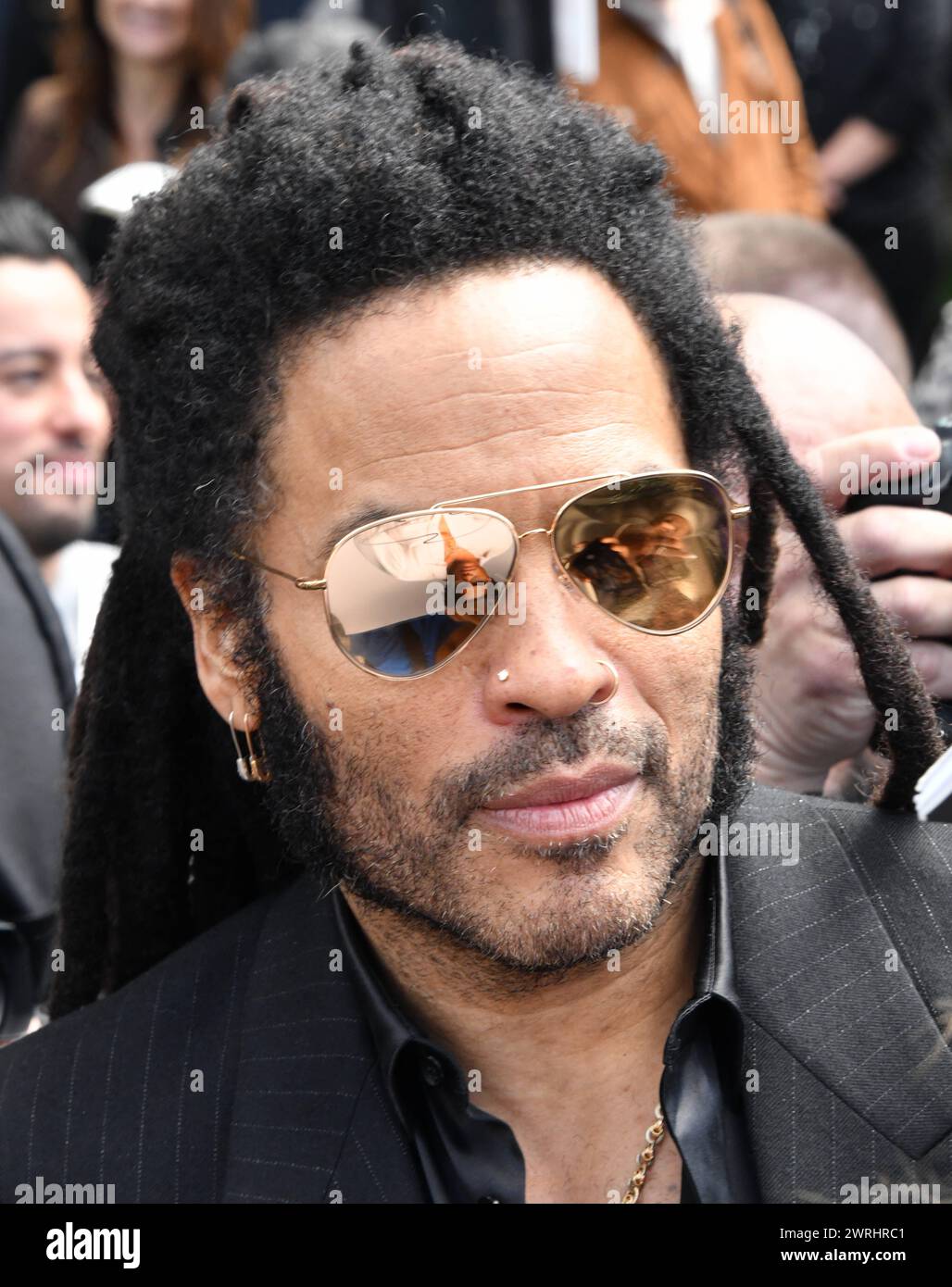 Lenny Kravitz signs autographs for fans as he ges his star on the ...
