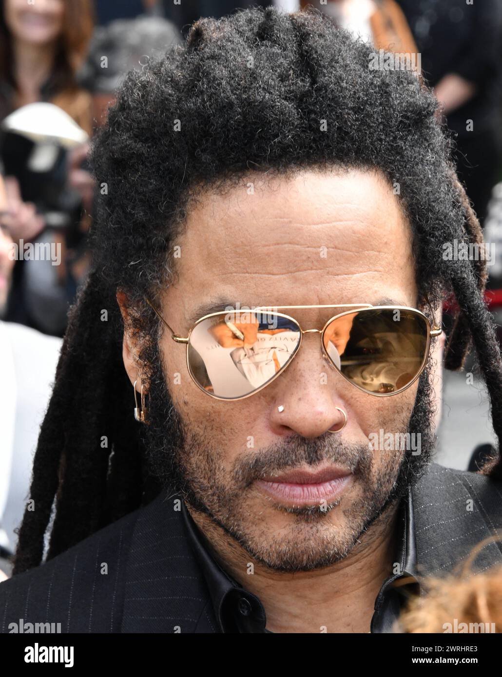 Lenny Kravitz signs autographs for fans as he ges his star on the ...
