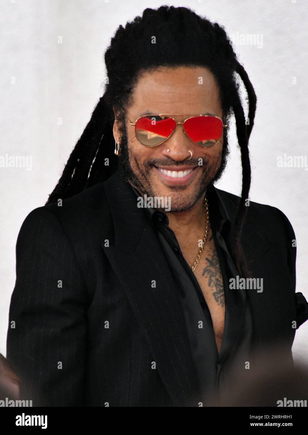 Lenny Kravitz signs autographs for fans as he ges his star on the ...