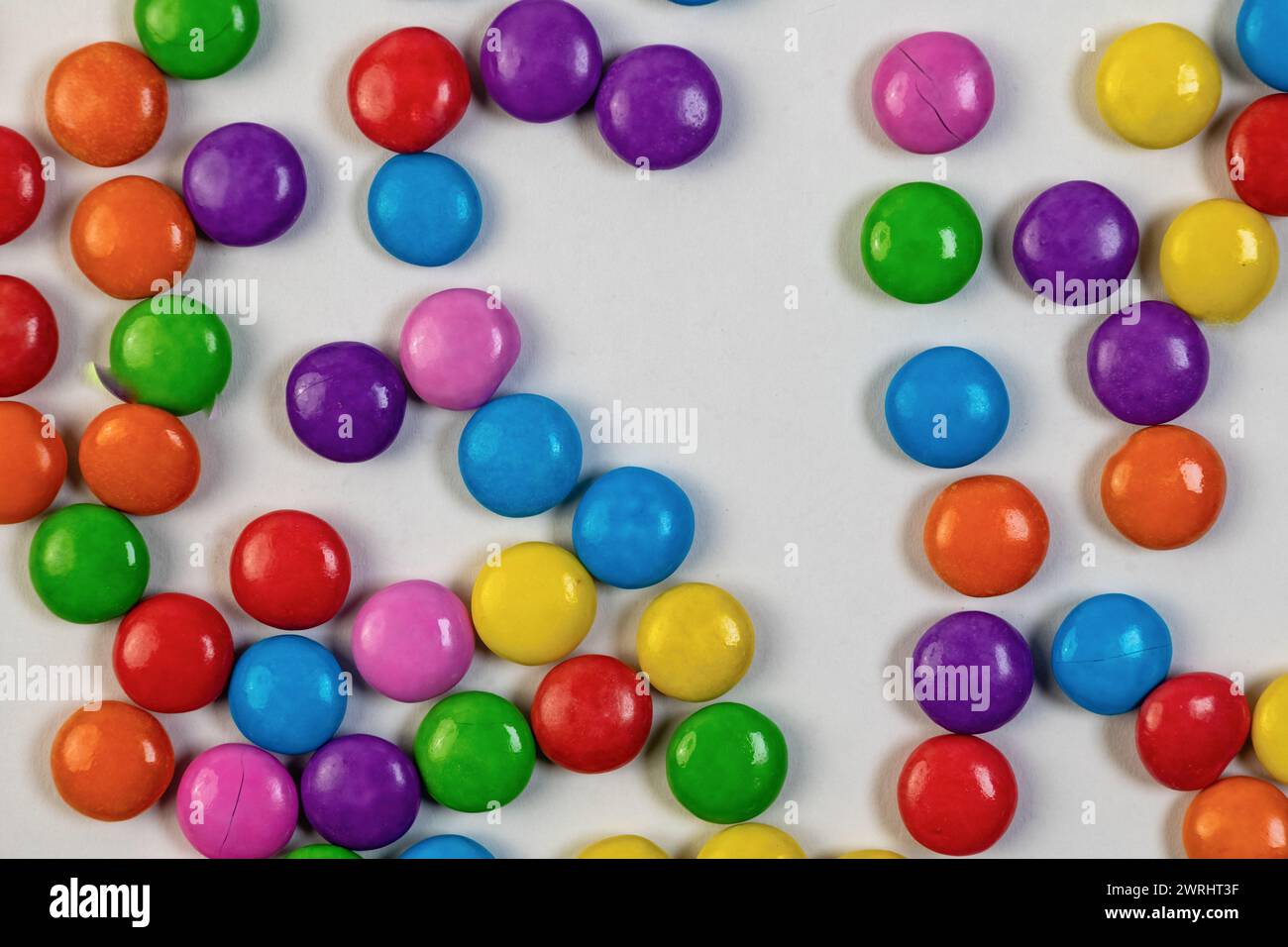 A delightful assortment of circular candies in a rainbow of colors ...