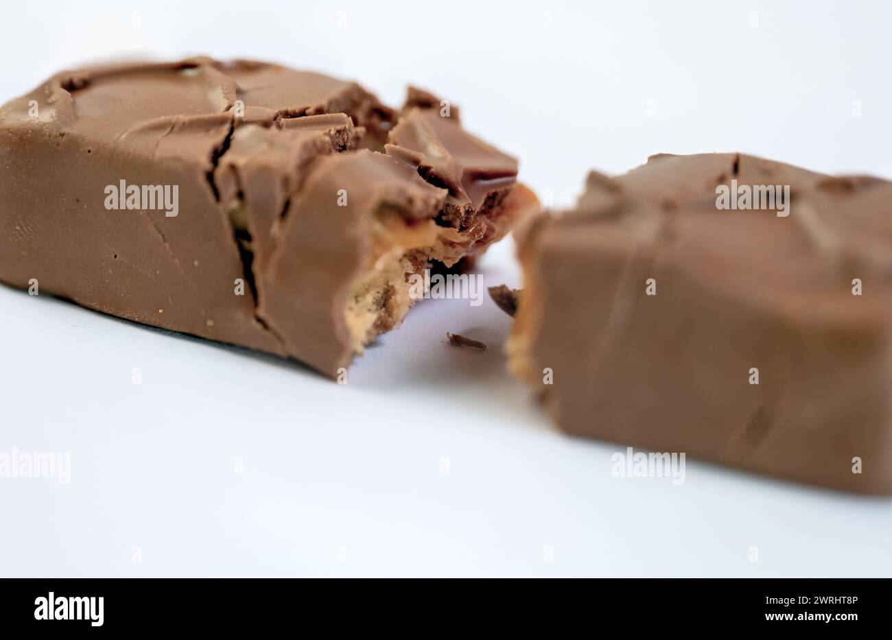 A close-up view of various chocolate bars artistically arranged on a ...