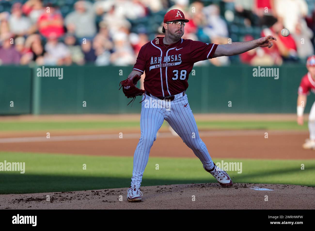 March 12, 2024: Arkansas pitcher Colin Fisher #38 turns to make a pick ...