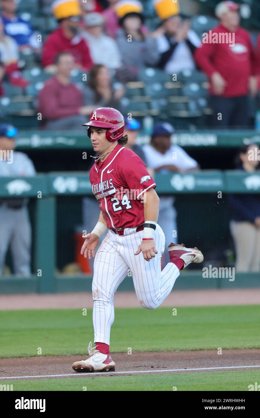 March 12, 2024: Razorback base runner Peyton Holt #24 comes down the ...