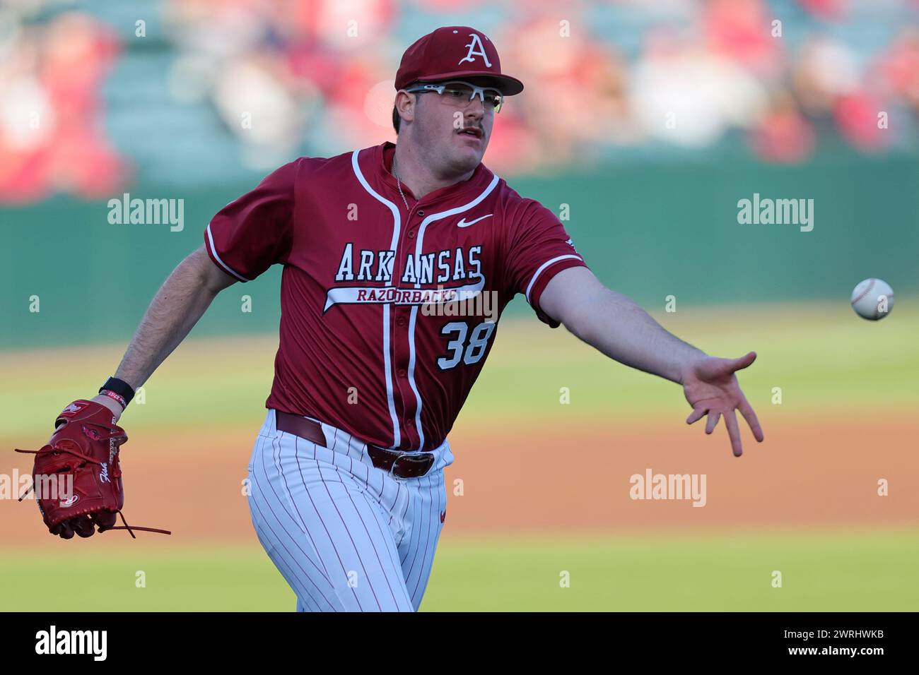 March 12, 2024: Razorback pitcher Colin Fisher #38 flips the ball under ...