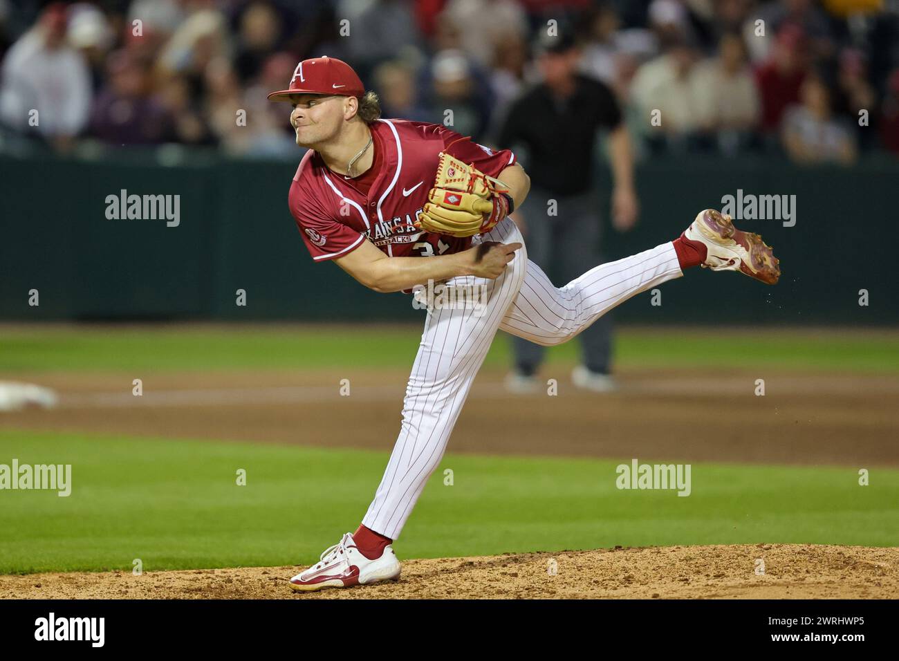 March 12, 2024: Razorback pitcher Dylan Carter #31 follows through on ...