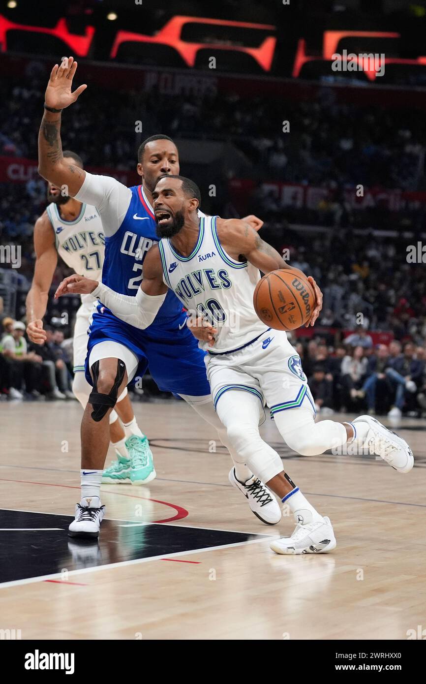 Minnesota Timberwolves guard Mike Conley (10) dribbles the ball past ...