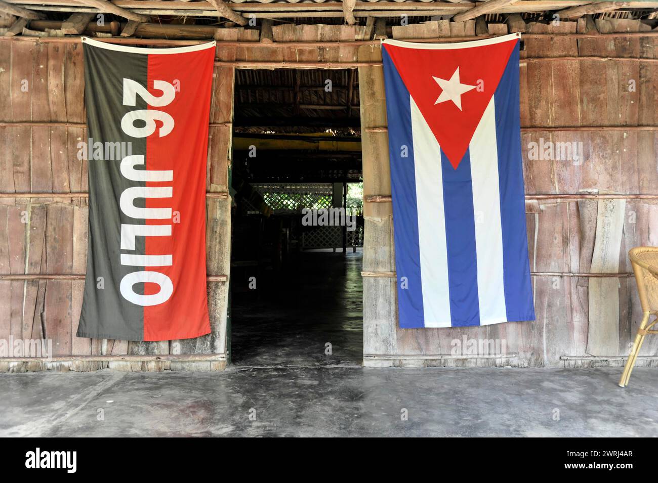 Cuban national flag next to a 26 July flag, revolutionary symbols ...