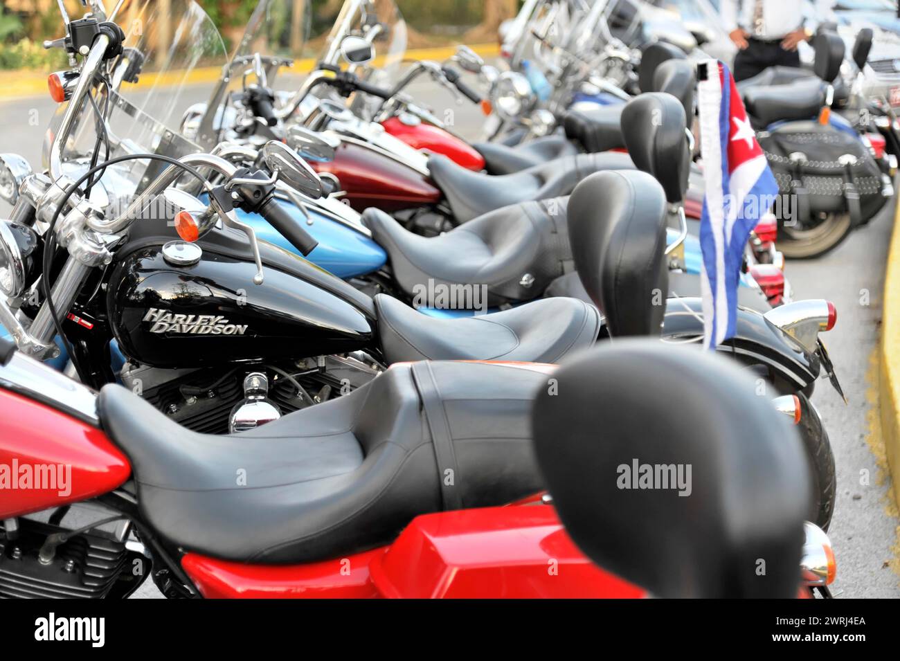 A row of Harley-Davidson motorbikes parked side by side on a road ...