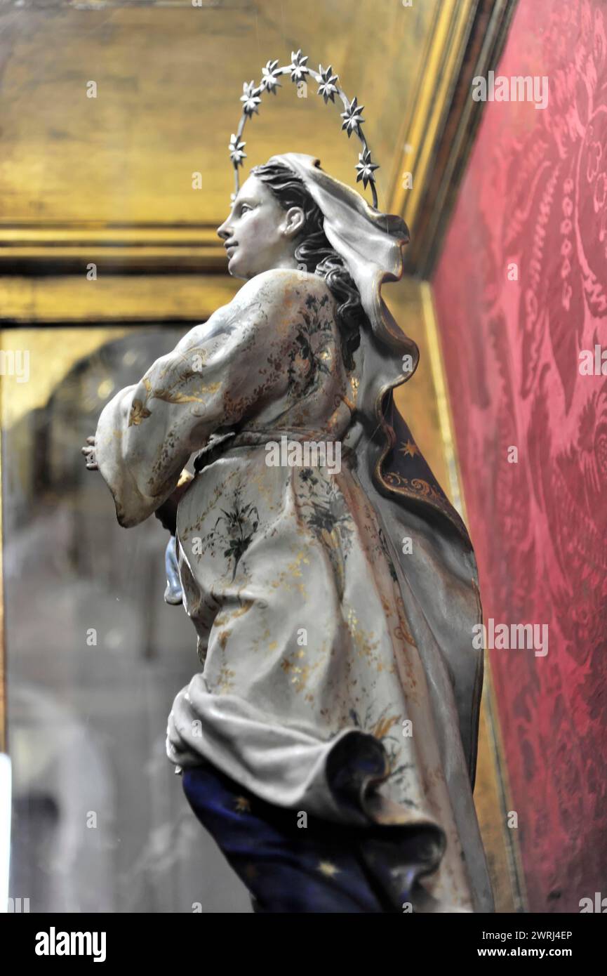 Decorated statue of an angel in baroque style with gilded elements, San ...