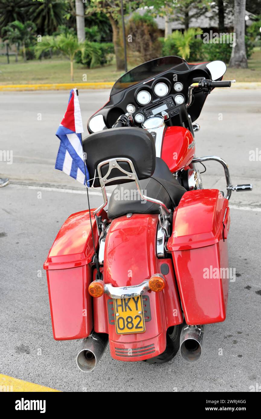 Red touring motorbike with panniers parked at the roadside, Parque ...