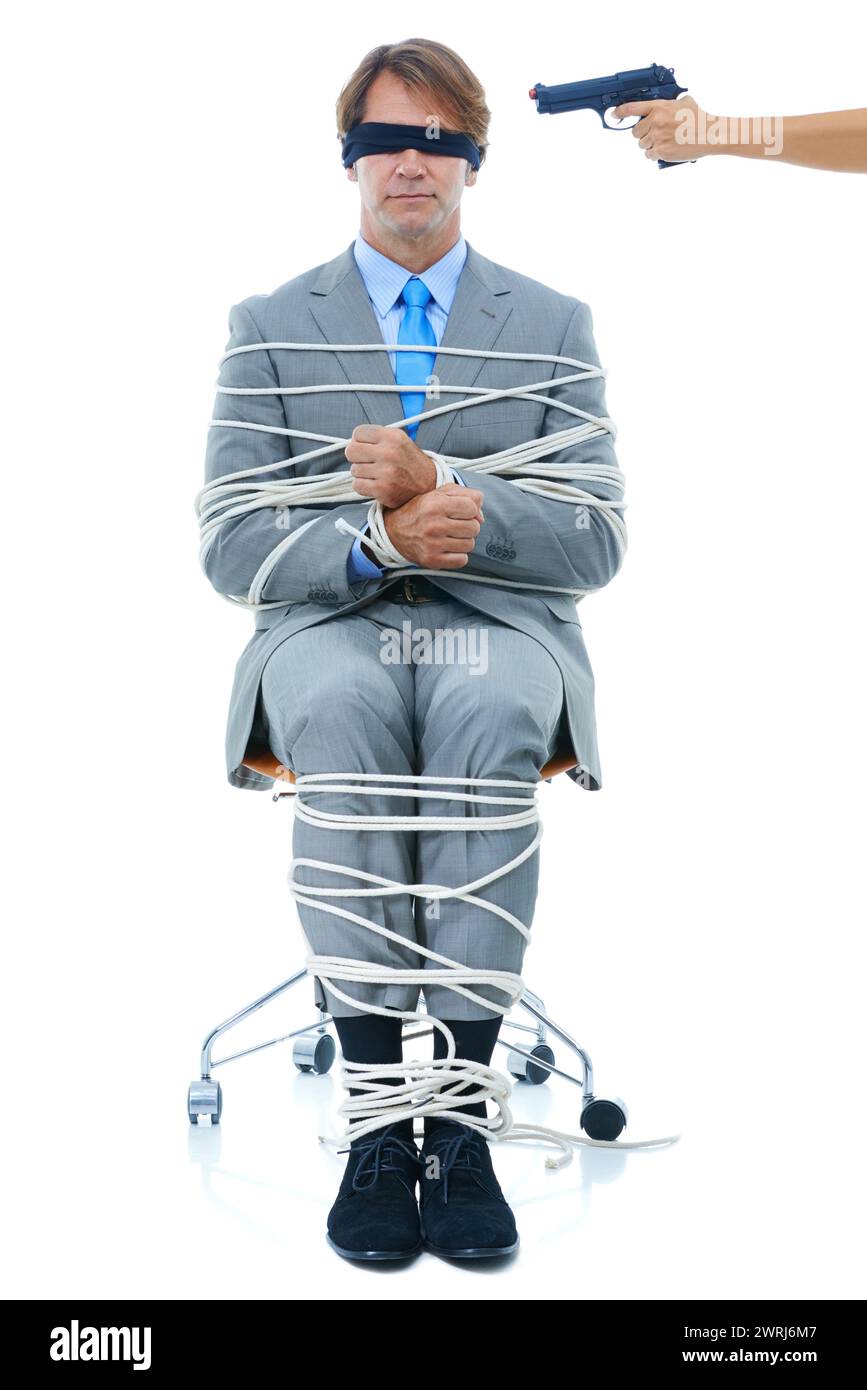 Businessman, tied up and hostage with gun on chair in kidnapped ...