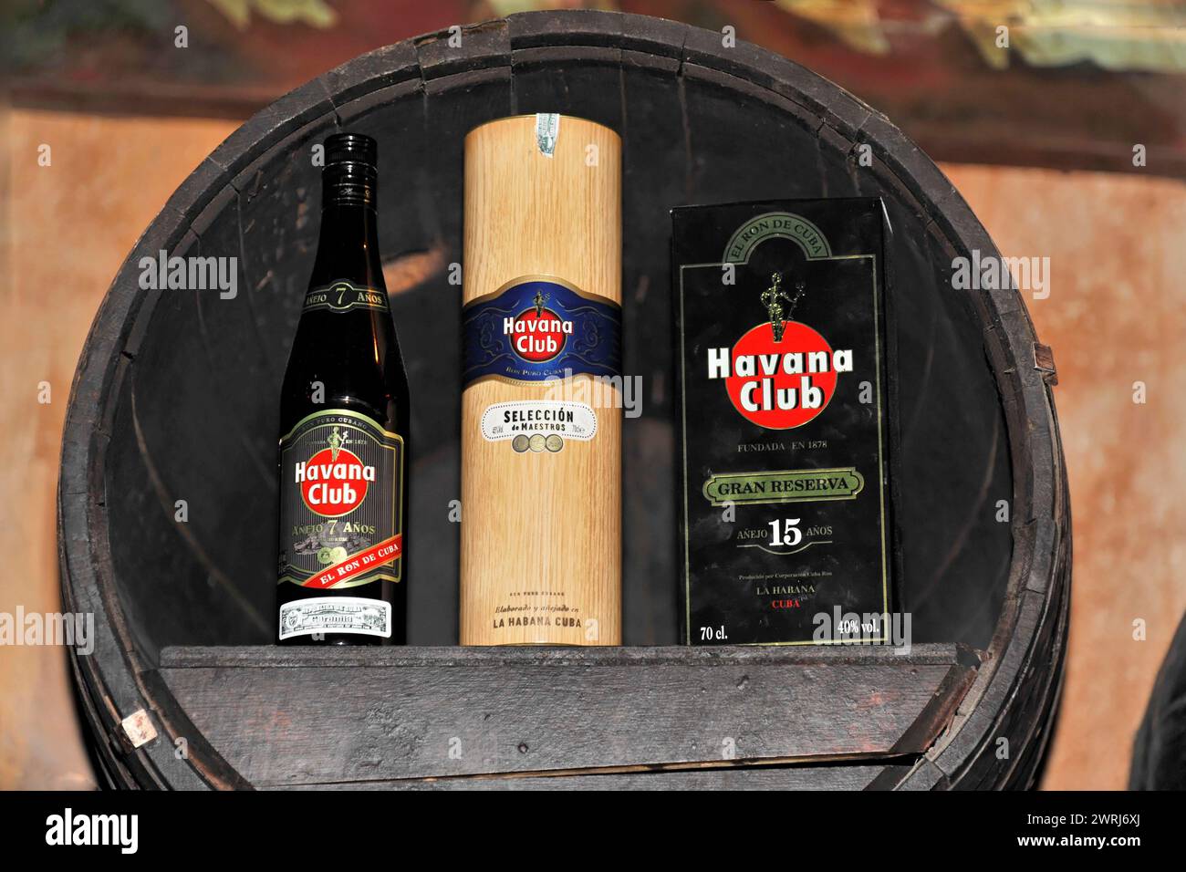 Bottles of Havana Club Rum arranged inside a dark wooden barrel, Havana ...
