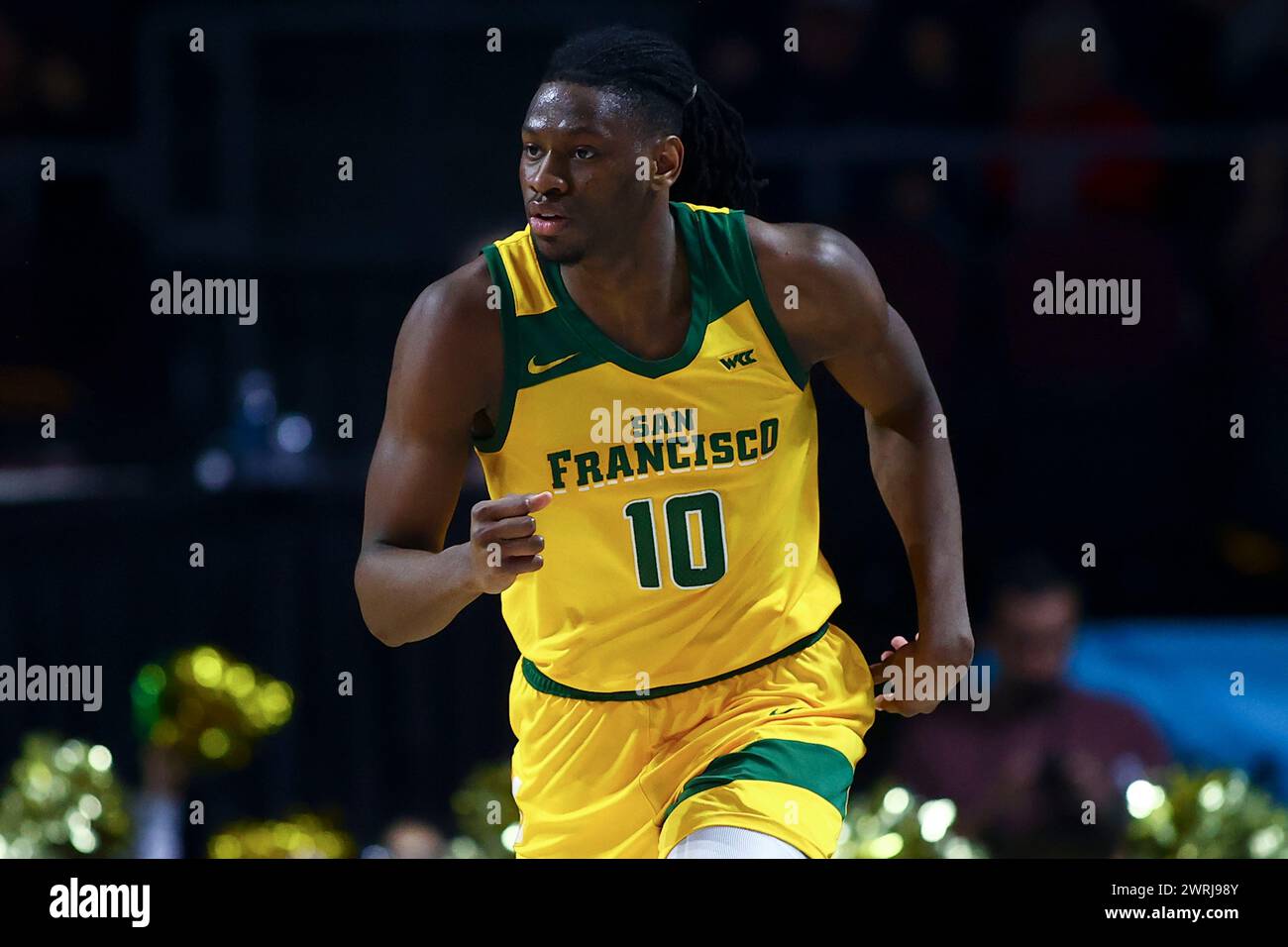 San Francisco forward Jonathan Mogbo runs up the court during the ...