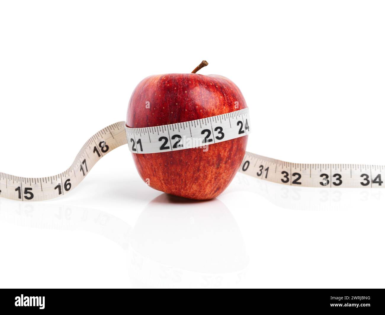 Apple, wellness and tape measure with red fruit in studio isolated on ...