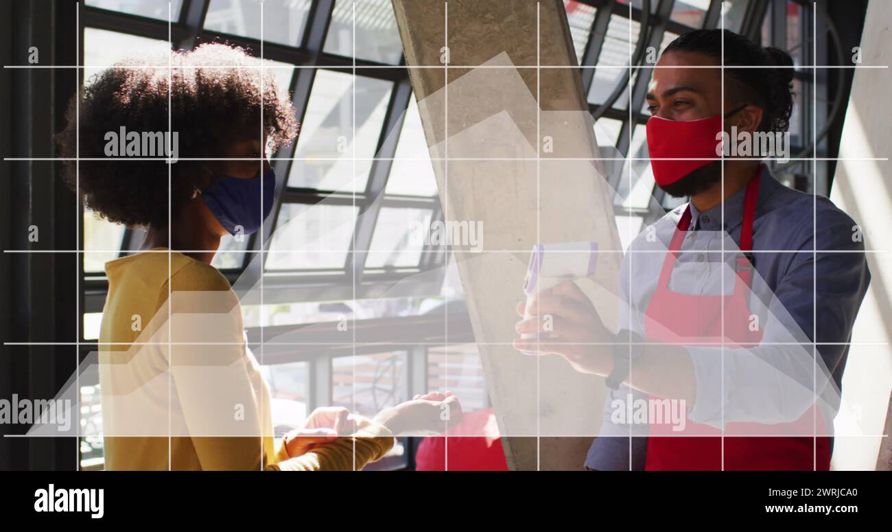 Image of digital interface and graph over diverse couple in face masks ...