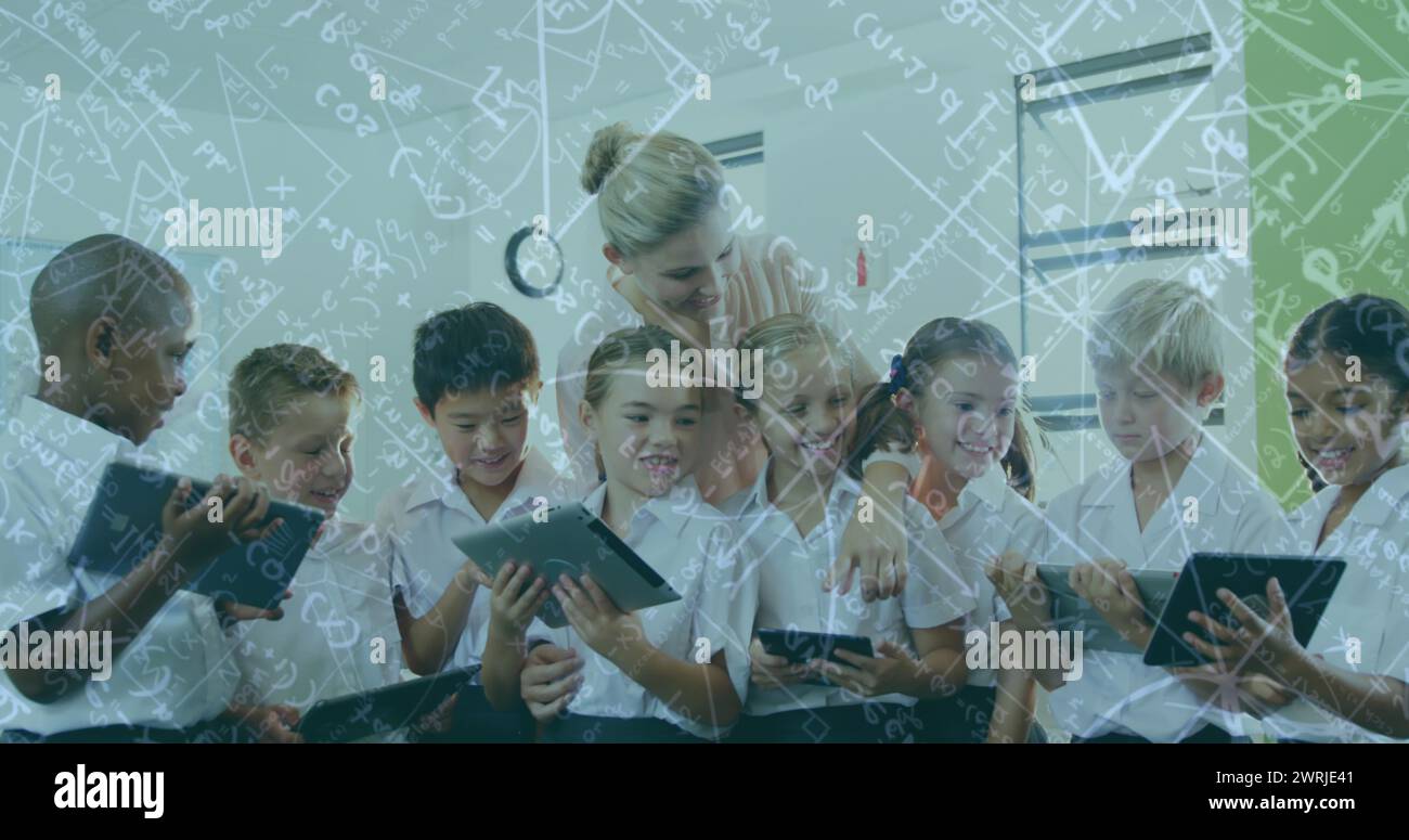 Image of school children using tablets over mathematical equations and grid Stock Photo - Alamy