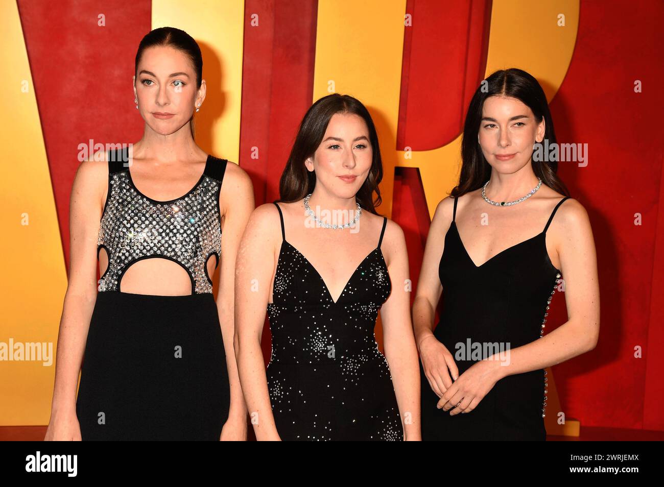 BEVERLY HILLS, CALIFORNIA - MARCH 10: (L-R) Este Haim, Alana Haim and ...