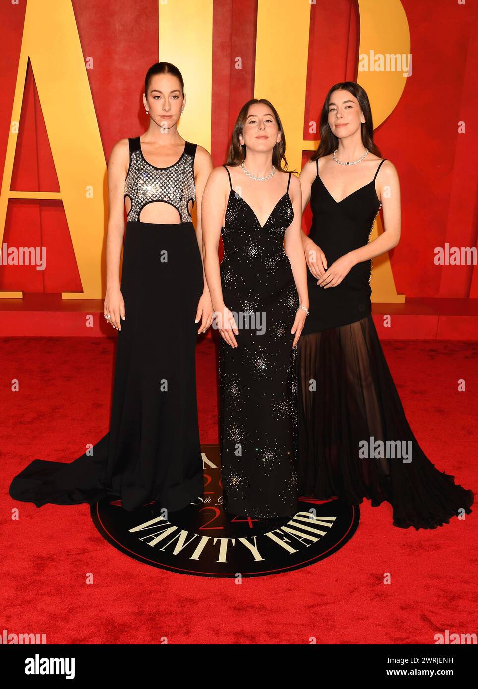 BEVERLY HILLS, CALIFORNIA - MARCH 10: (L-R) Este Haim, Alana Haim and ...