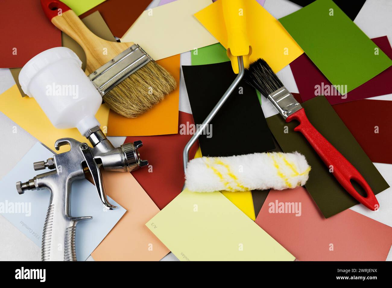 Paint spray gun at work at the workplace in the workshop. Paint Brush ...