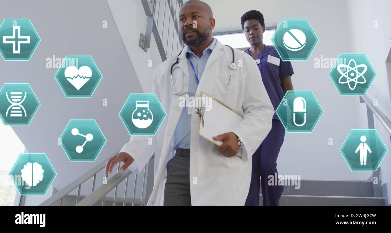 Image of medical icons over african american female and male doctor ...